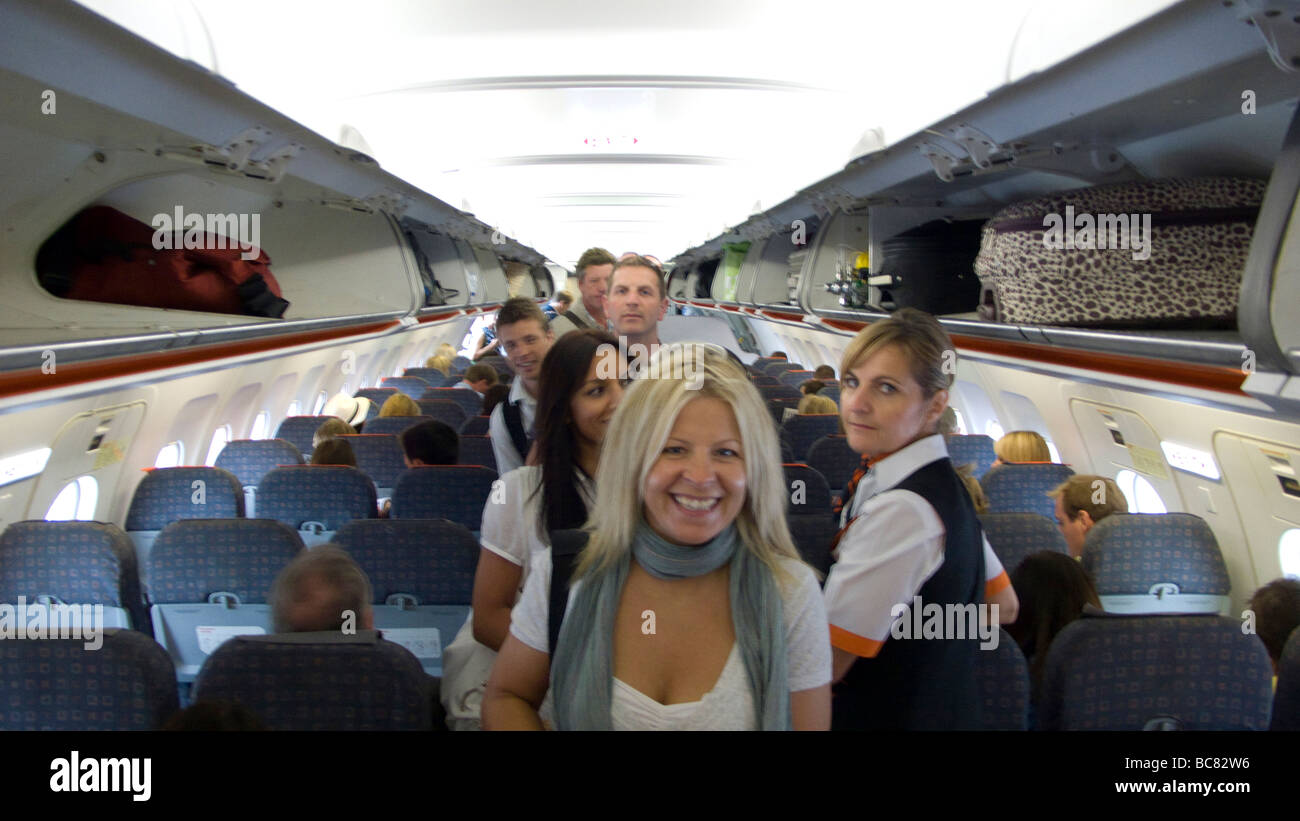 Easyjet passengers finding their seats on a flight Stock Photo - Alamy