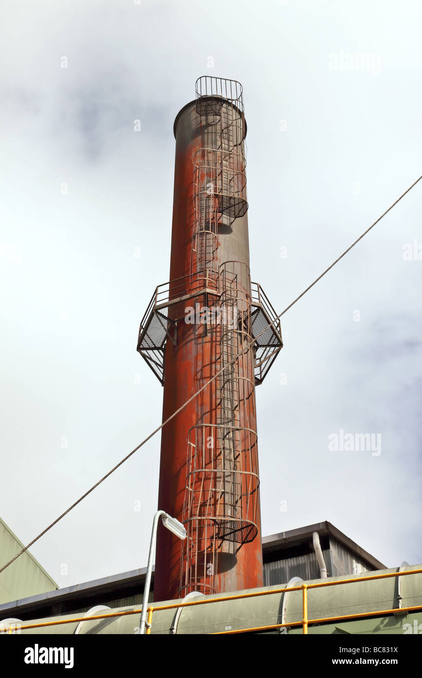Extractor chimney of a sugar mill vents stands idle Stock Photo - Alamy