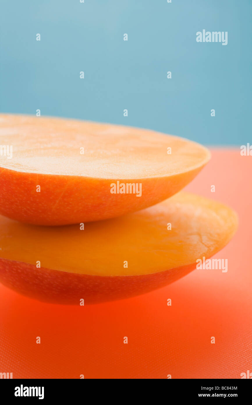 Two mango halves Stock Photo - Alamy