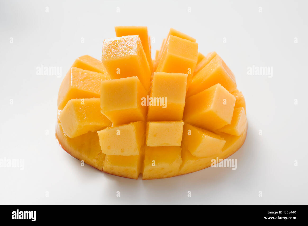 Diced mango still attached to the skin Stock Photo - Alamy