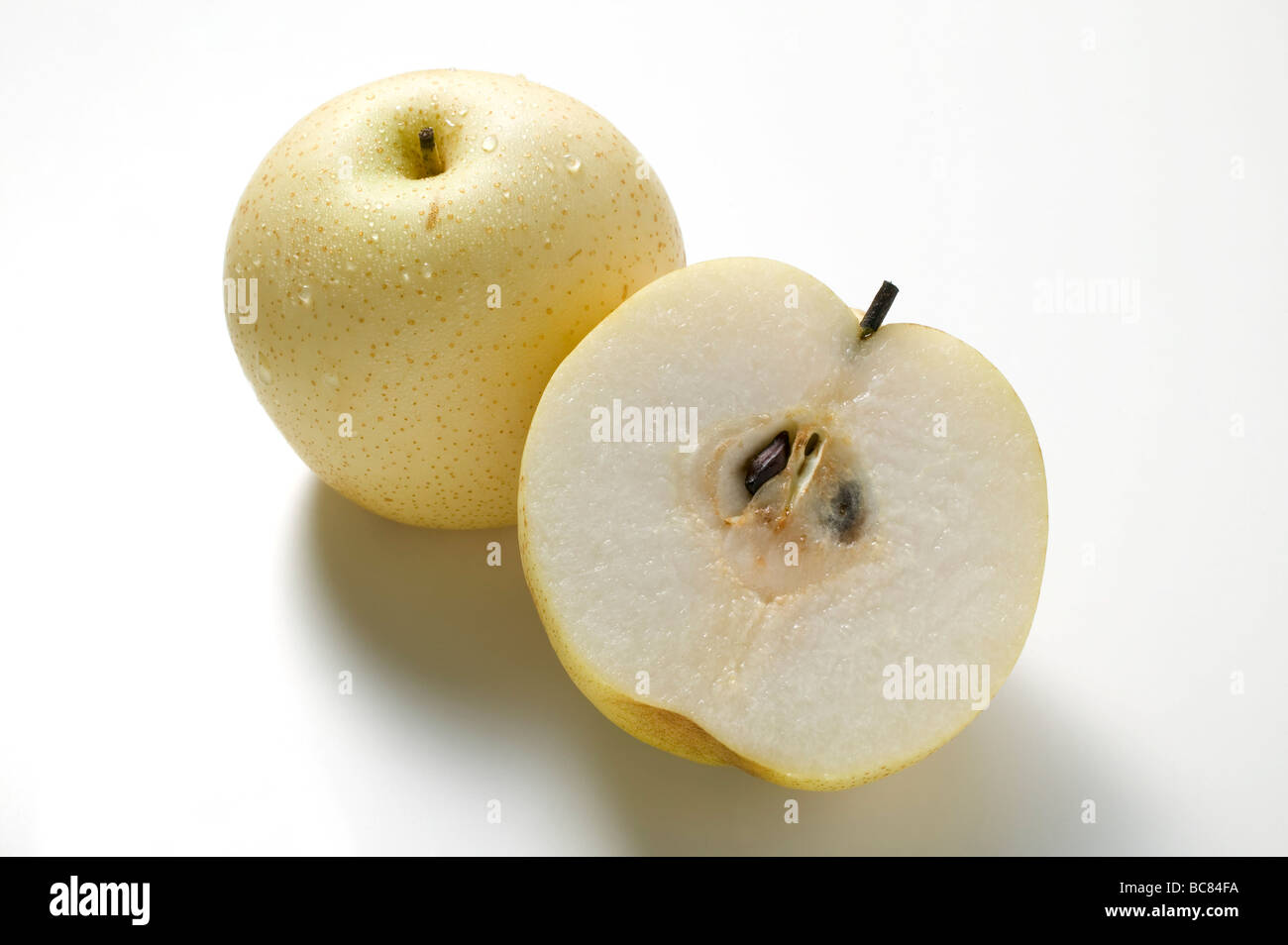 Whole Nashi pear and half a Nashi pear (overhead view Stock Photo - Alamy