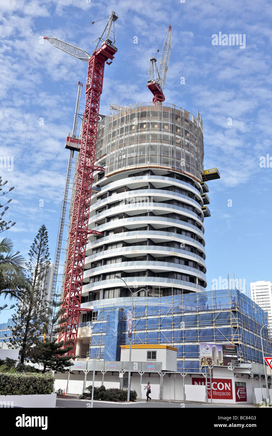 Modern apartment skyscraper building under construction against a blue ...