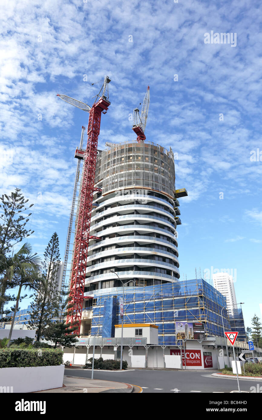 Modern apartment skyscraper building under construction against a blue ...
