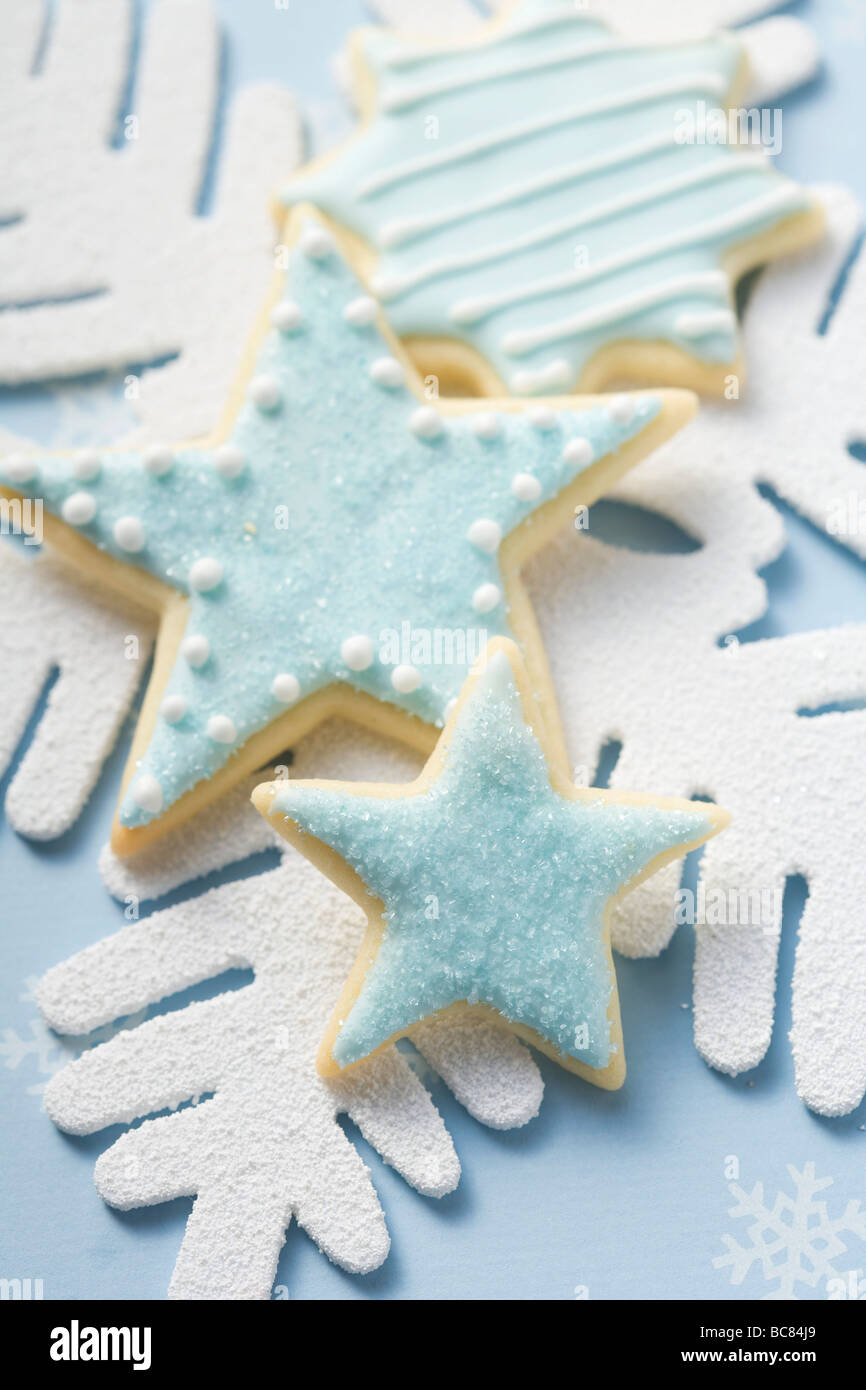 Three star biscuits with blue icing Stock Photo - Alamy