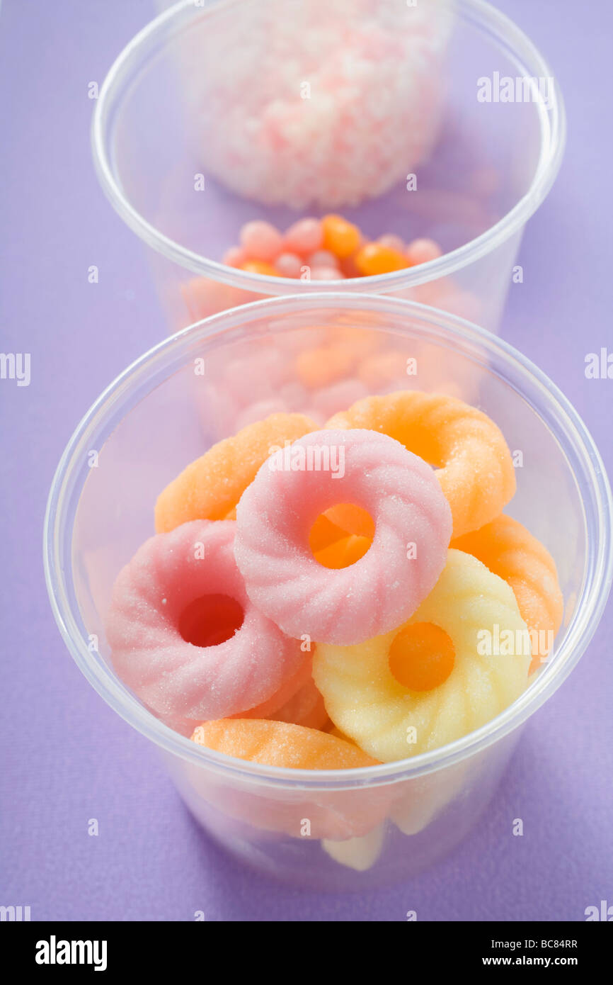 Sugar rings and other sweets in plastic tubs Stock Photo - Alamy