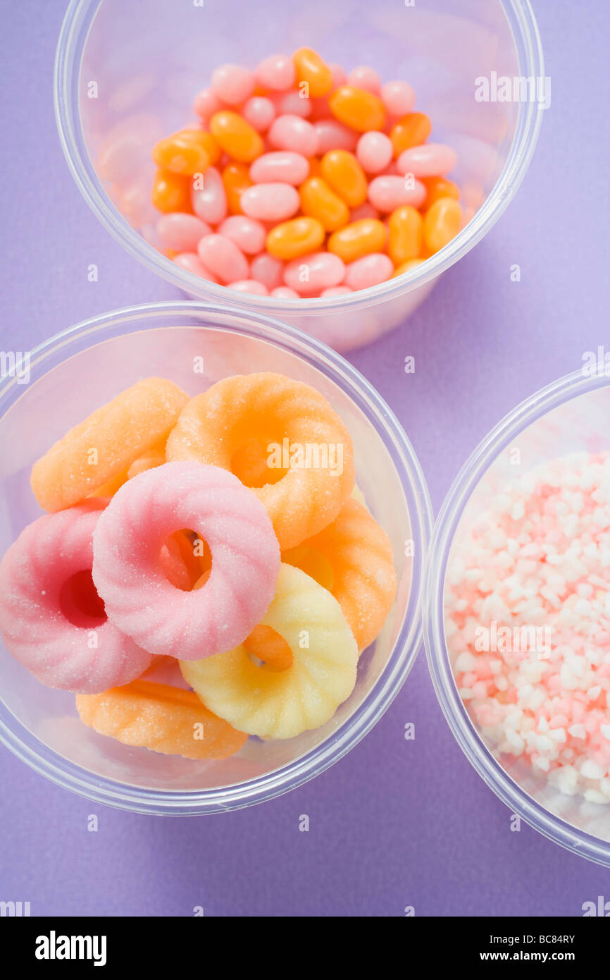 Sugar rings and other sweets in plastic tubs Stock Photo - Alamy