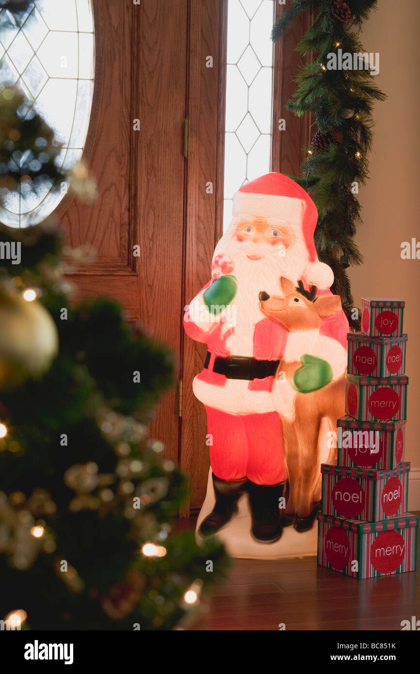 Illuminated Father Christmas with reindeer Stock Photo - Alamy