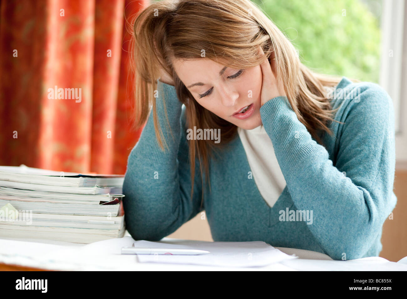 young female teacher marking work Stock Photo - Alamy