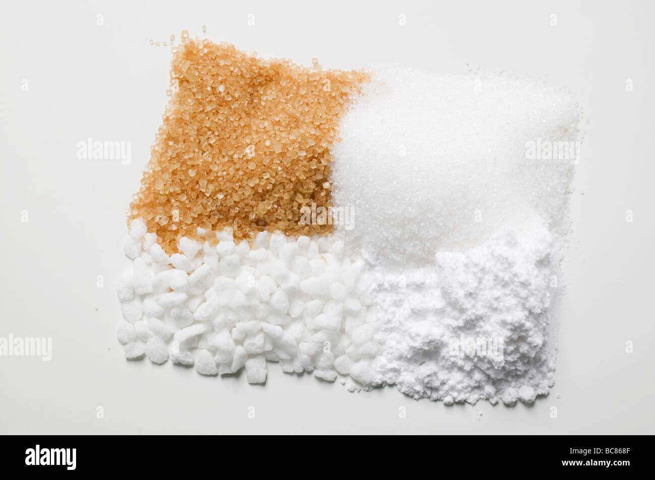 Four different types of sugar Stock Photo - Alamy