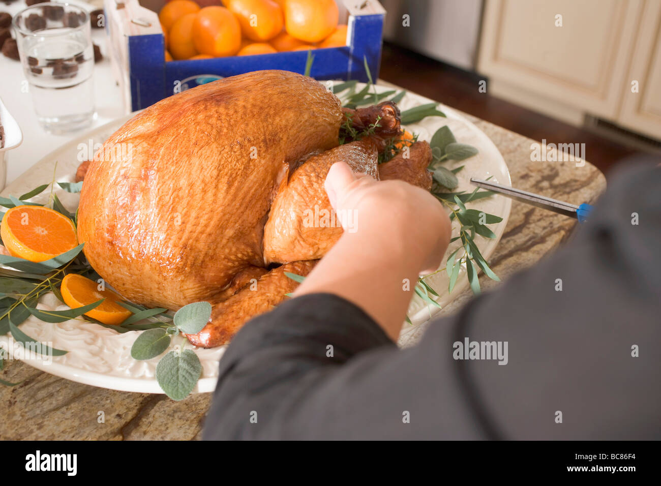 Garnishing roast turkey on platter Stock Photo - Alamy