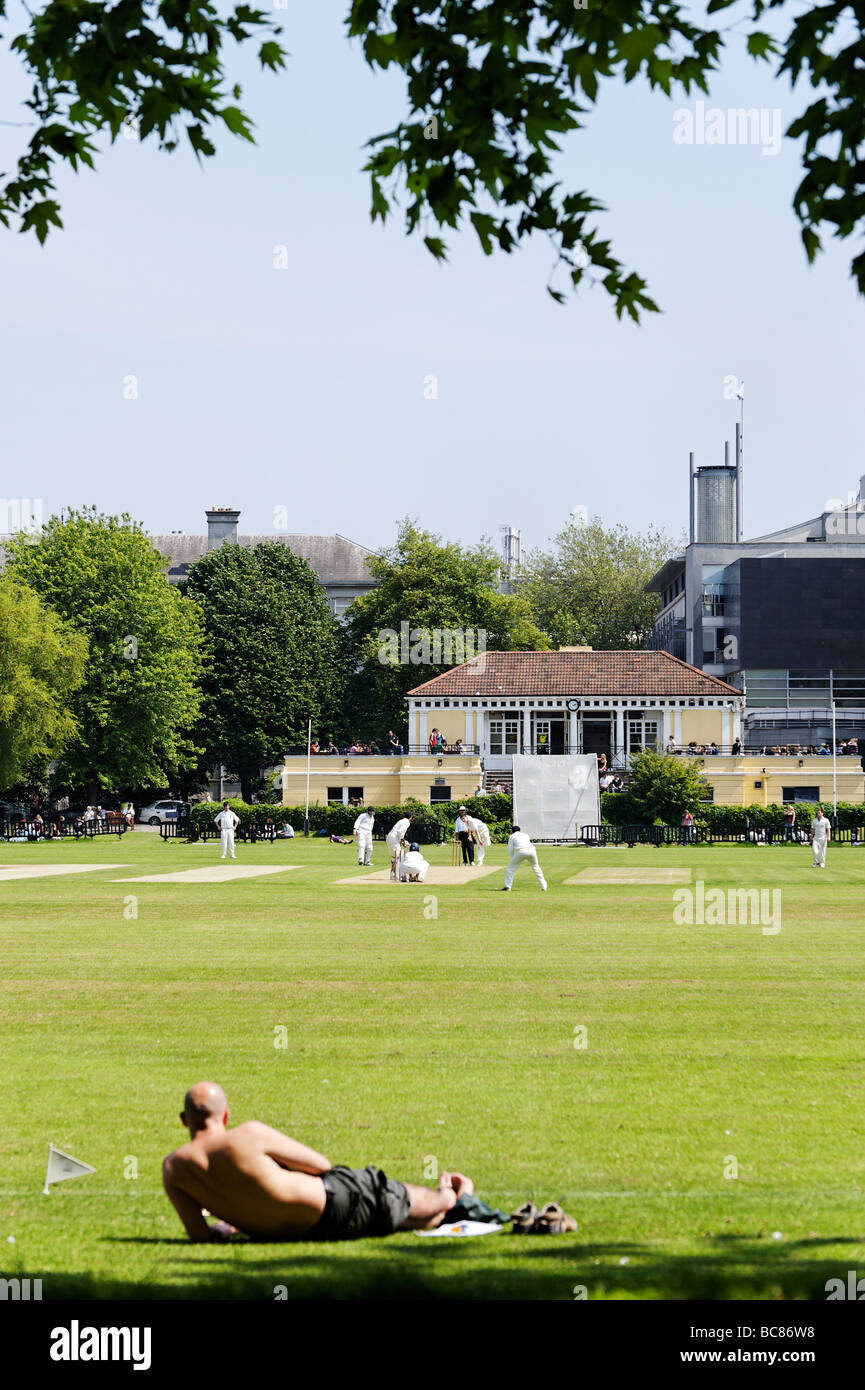 Spectator watching a match during lunch break at Trinity College ...