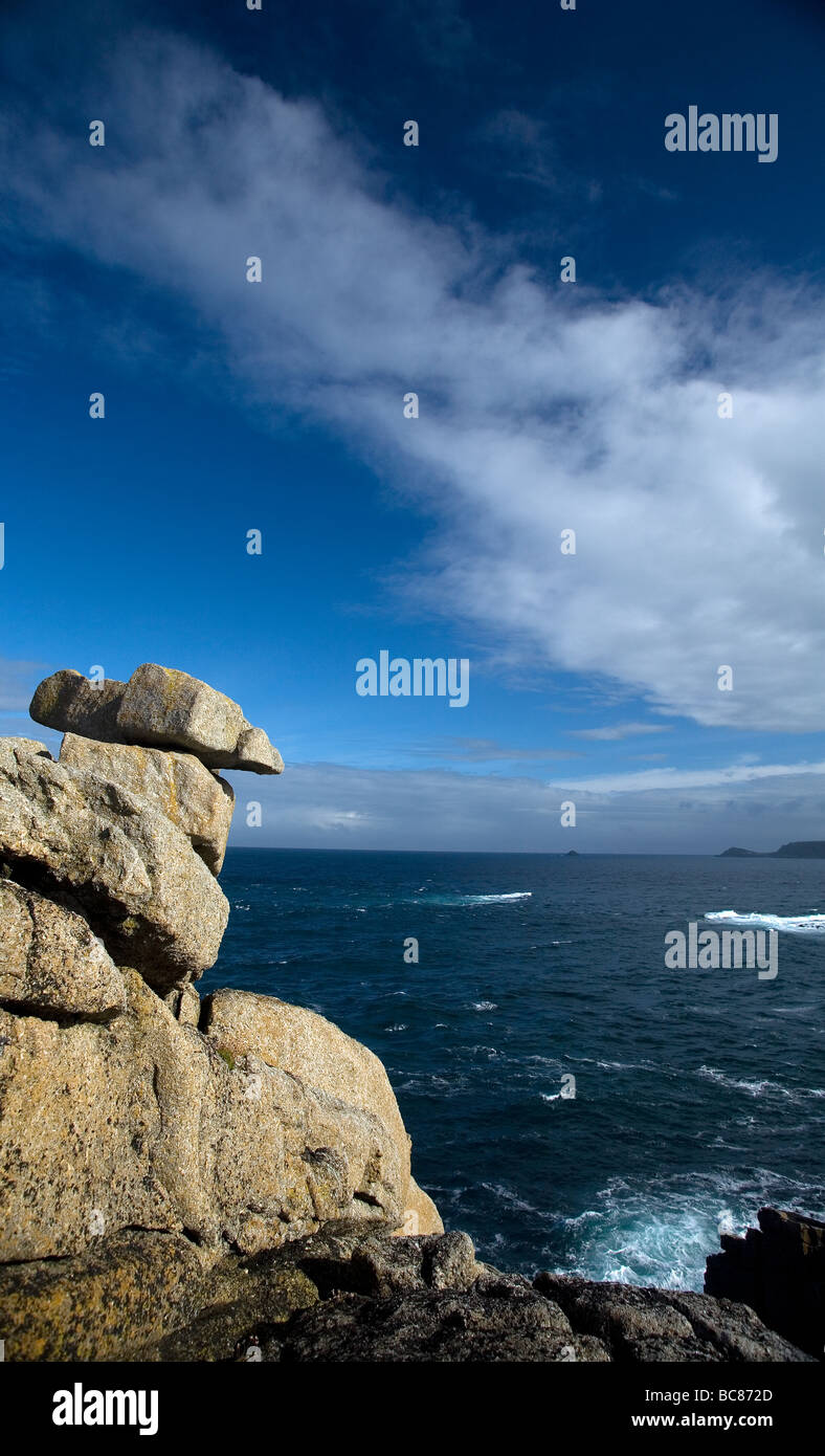 Natural rock formation overlooking deep blue Cornish sea and endless ...