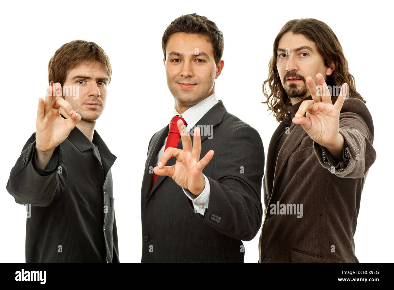 three business men isolated on white background Stock Photo - Alamy