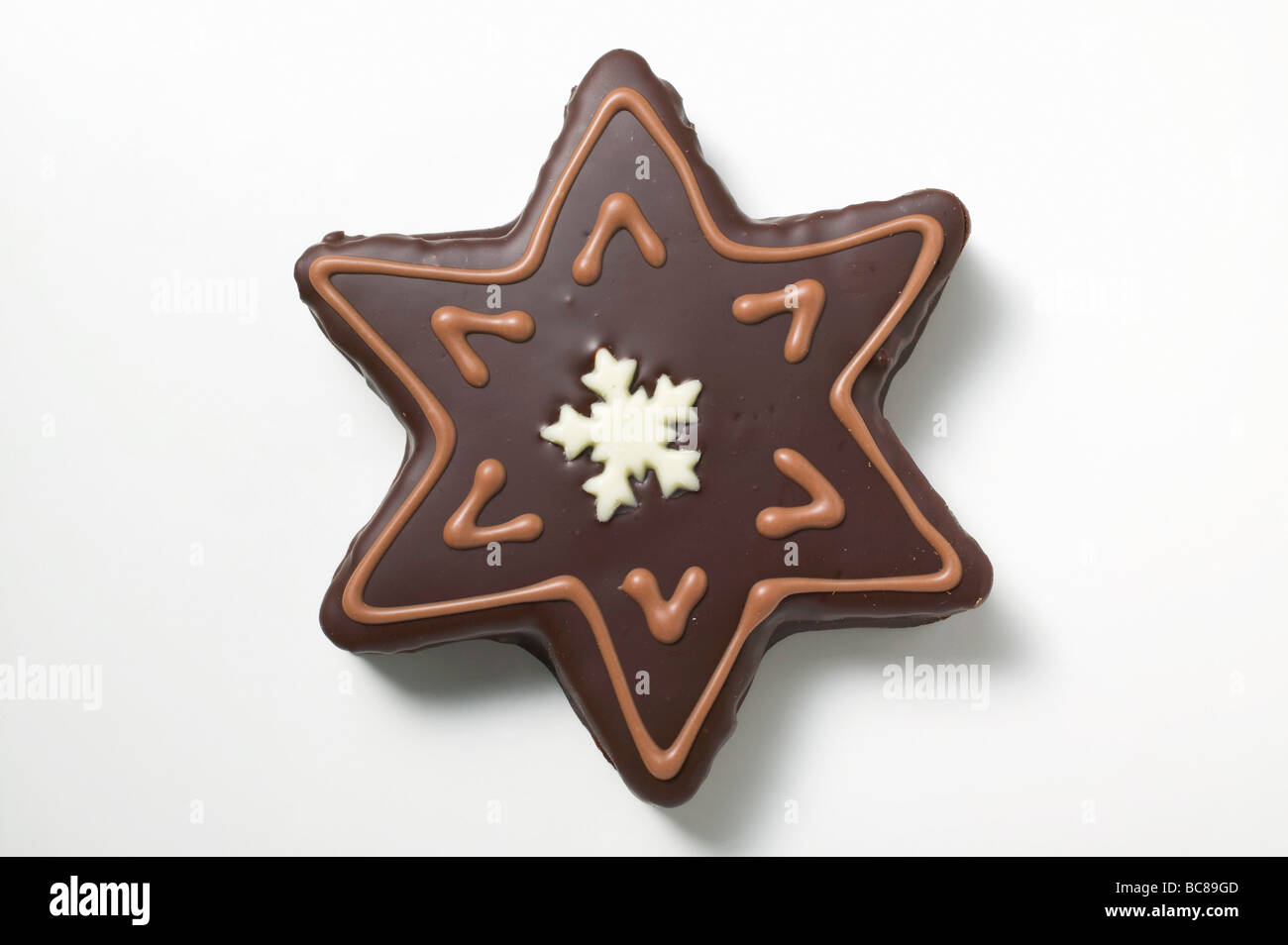 Star biscuit with chocolate icing Stock Photo - Alamy