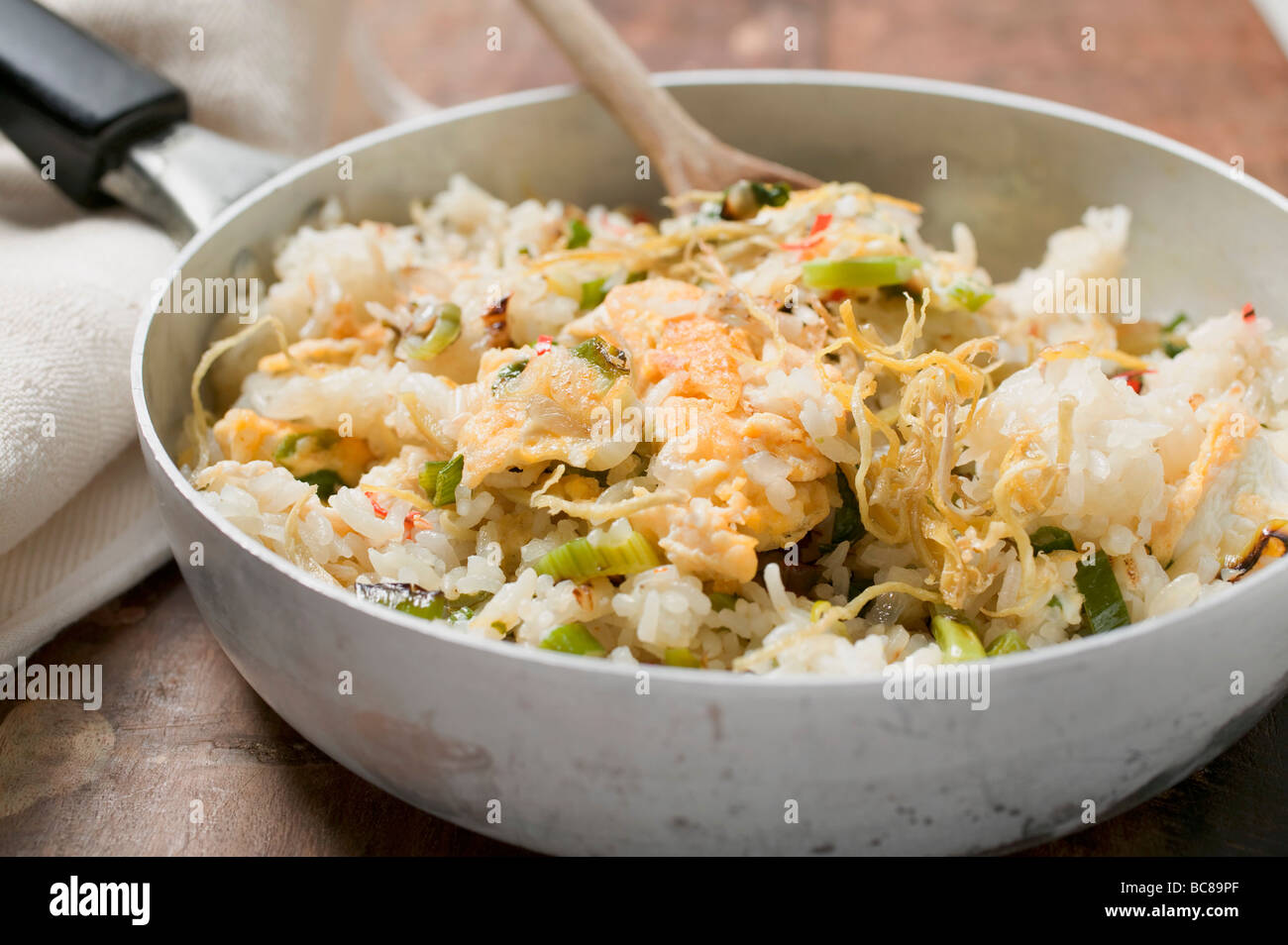 Pan-cooked rice and fish dish with lemon zest Stock Photo - Alamy