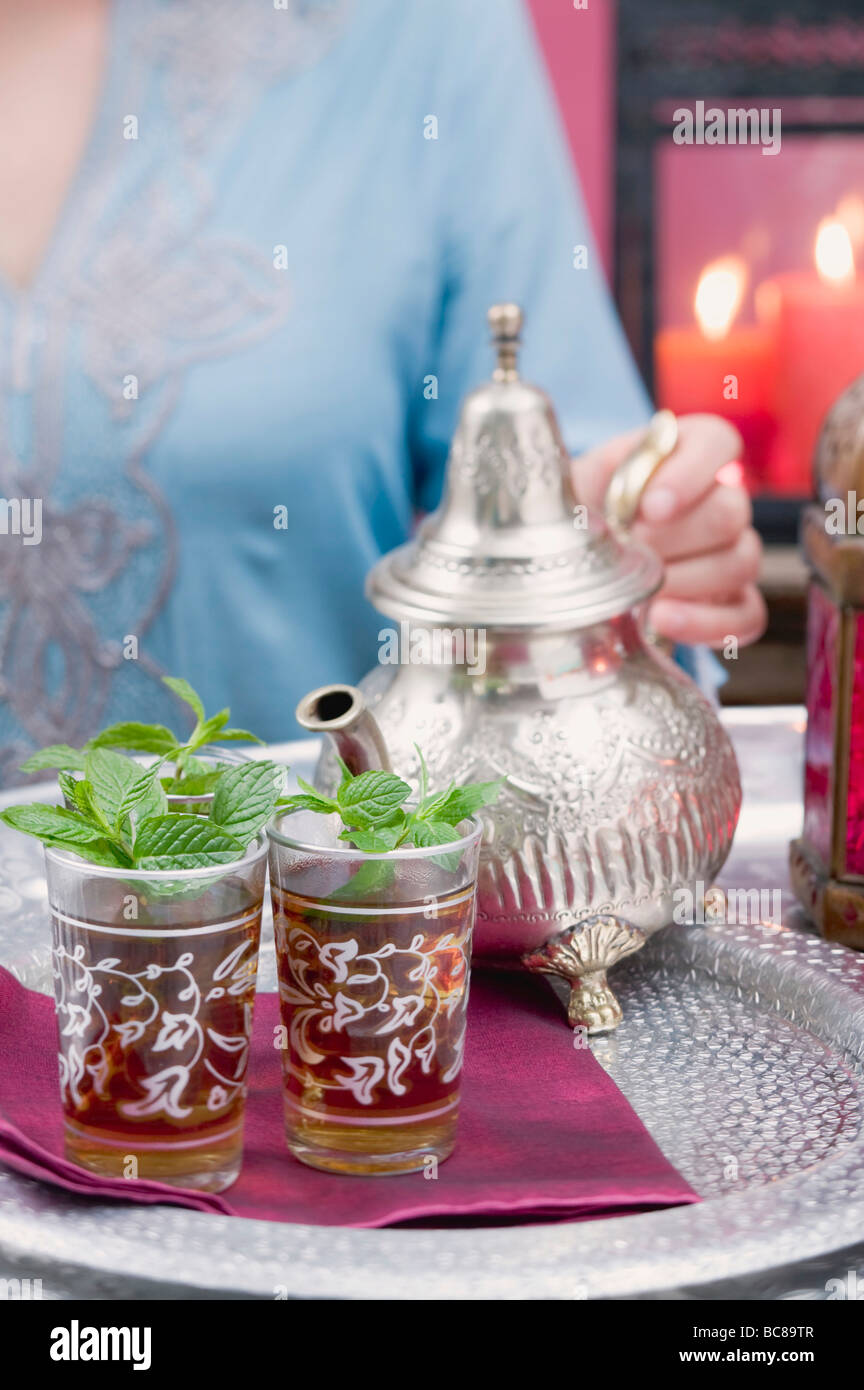 Teapot pouring out tea hi-res stock photography and images - Alamy