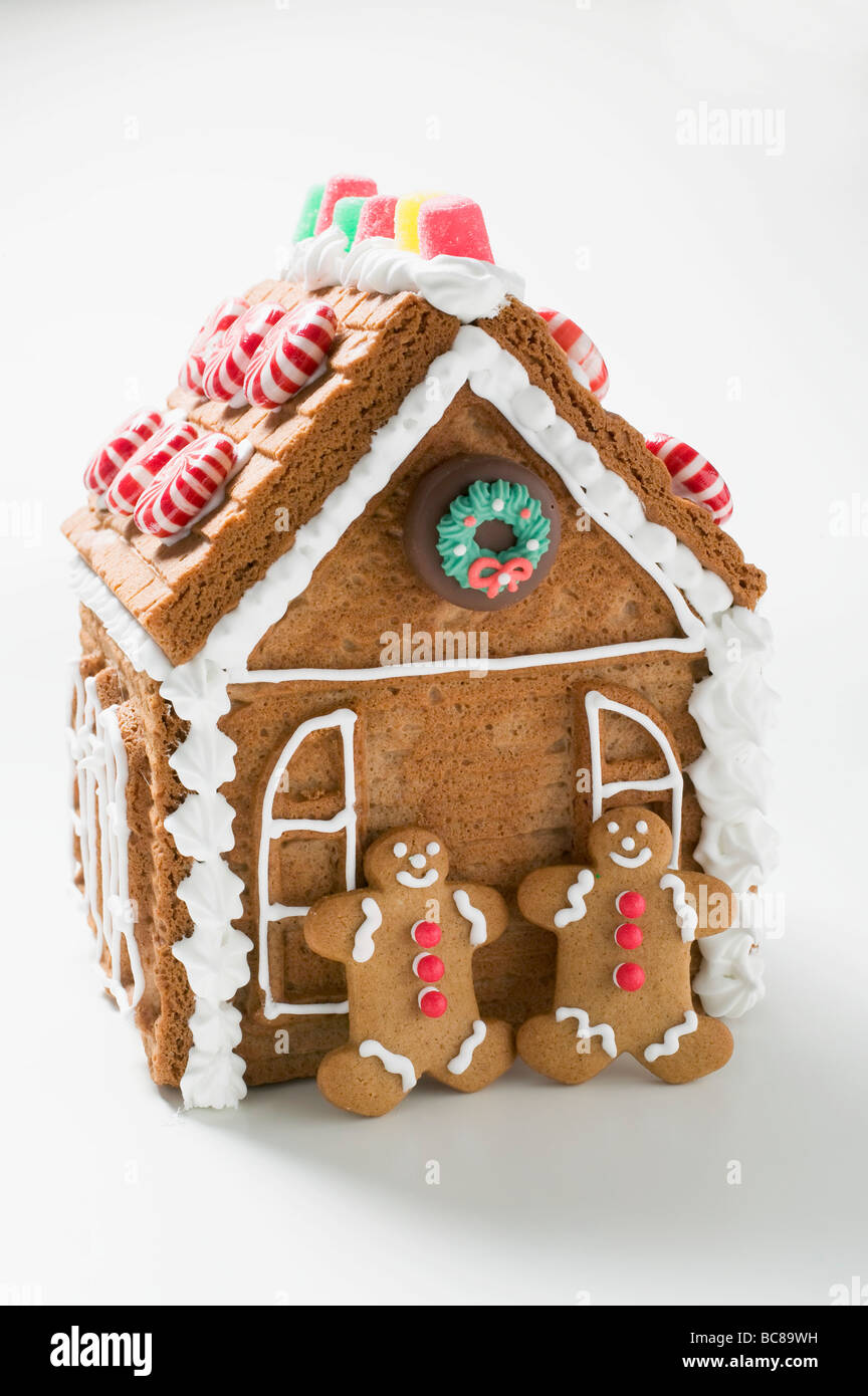 Gingerbread house with two gingerbread men Stock Photo - Alamy