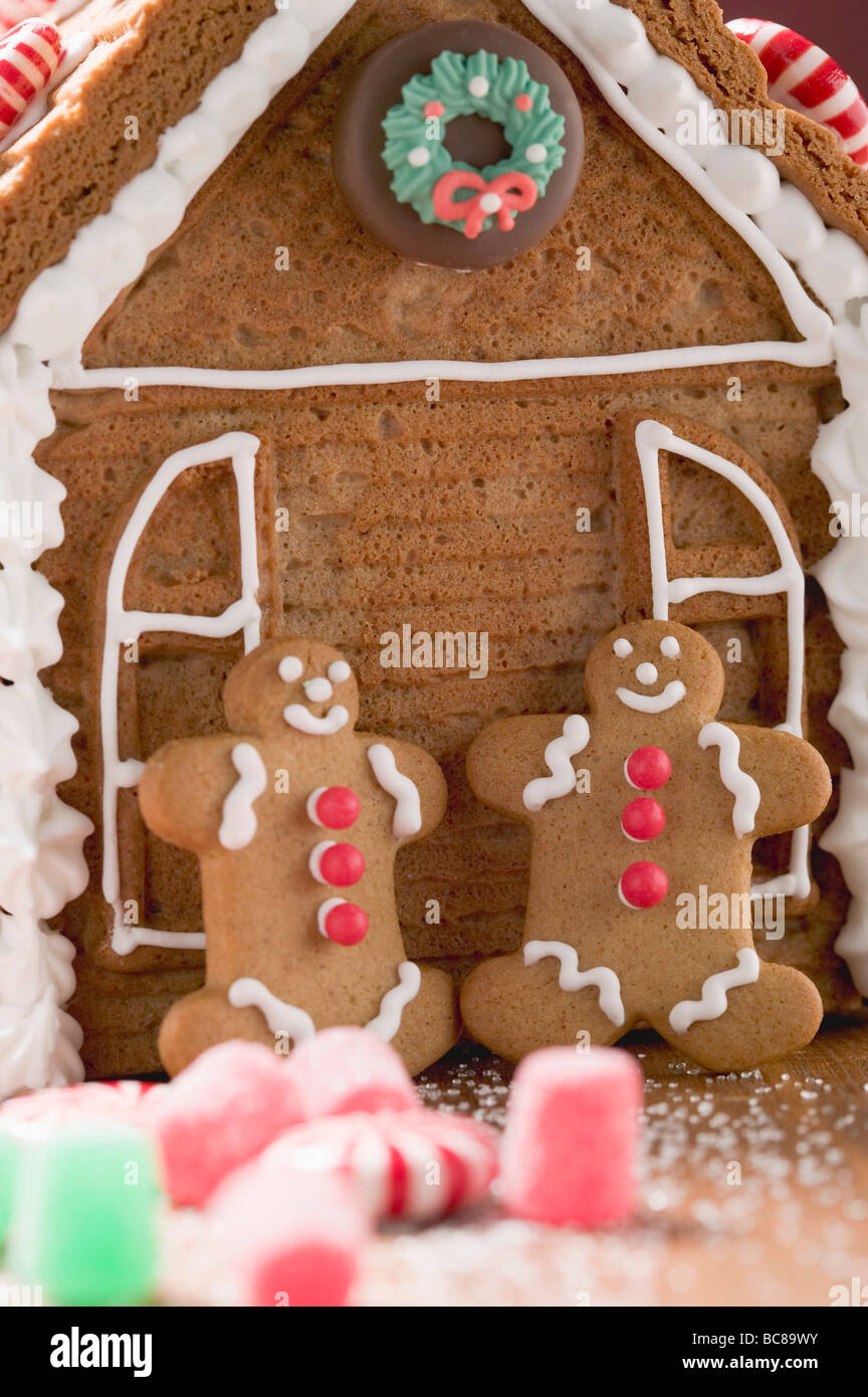 Gingerbread house with two gingerbread men Stock Photo - Alamy