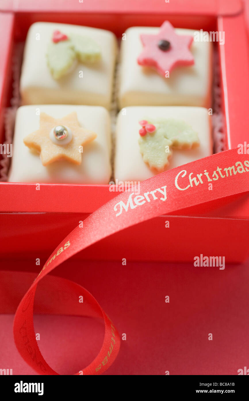 Four petit fours in red box (for Christmas Stock Photo - Alamy