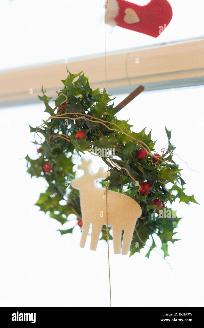 Christmas window decoration (holly and reindeer Stock Photo - Alamy