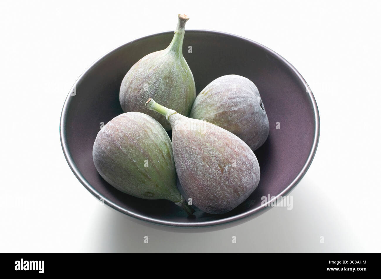 Four fresh figs in bowl Stock Photo - Alamy