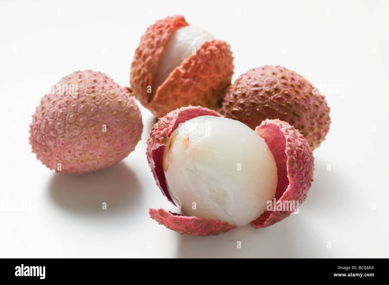 Lychees, whole and with opened peel Stock Photo - Alamy