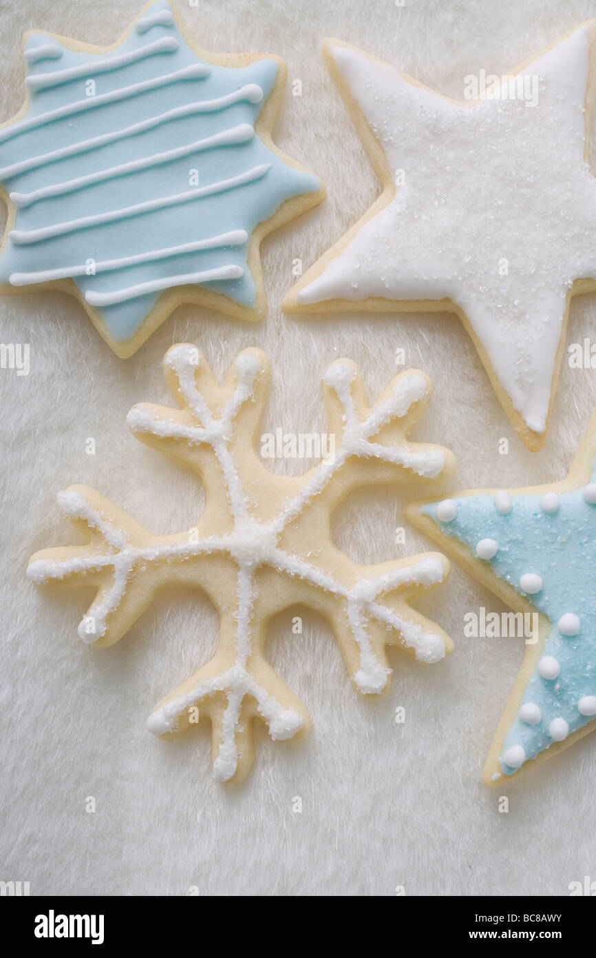 Four iced Christmas biscuits Stock Photo - Alamy