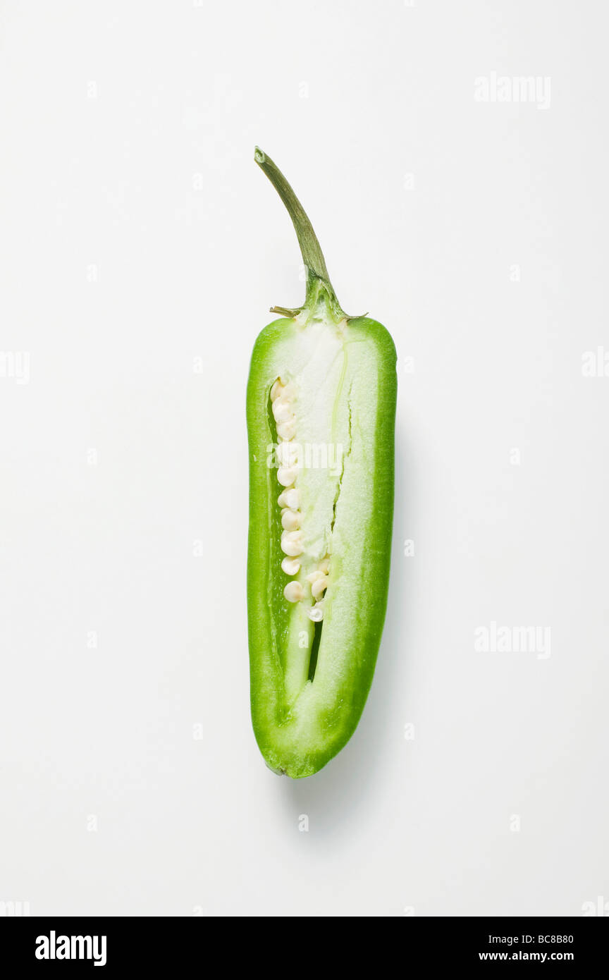 Half a green chilli Stock Photo - Alamy