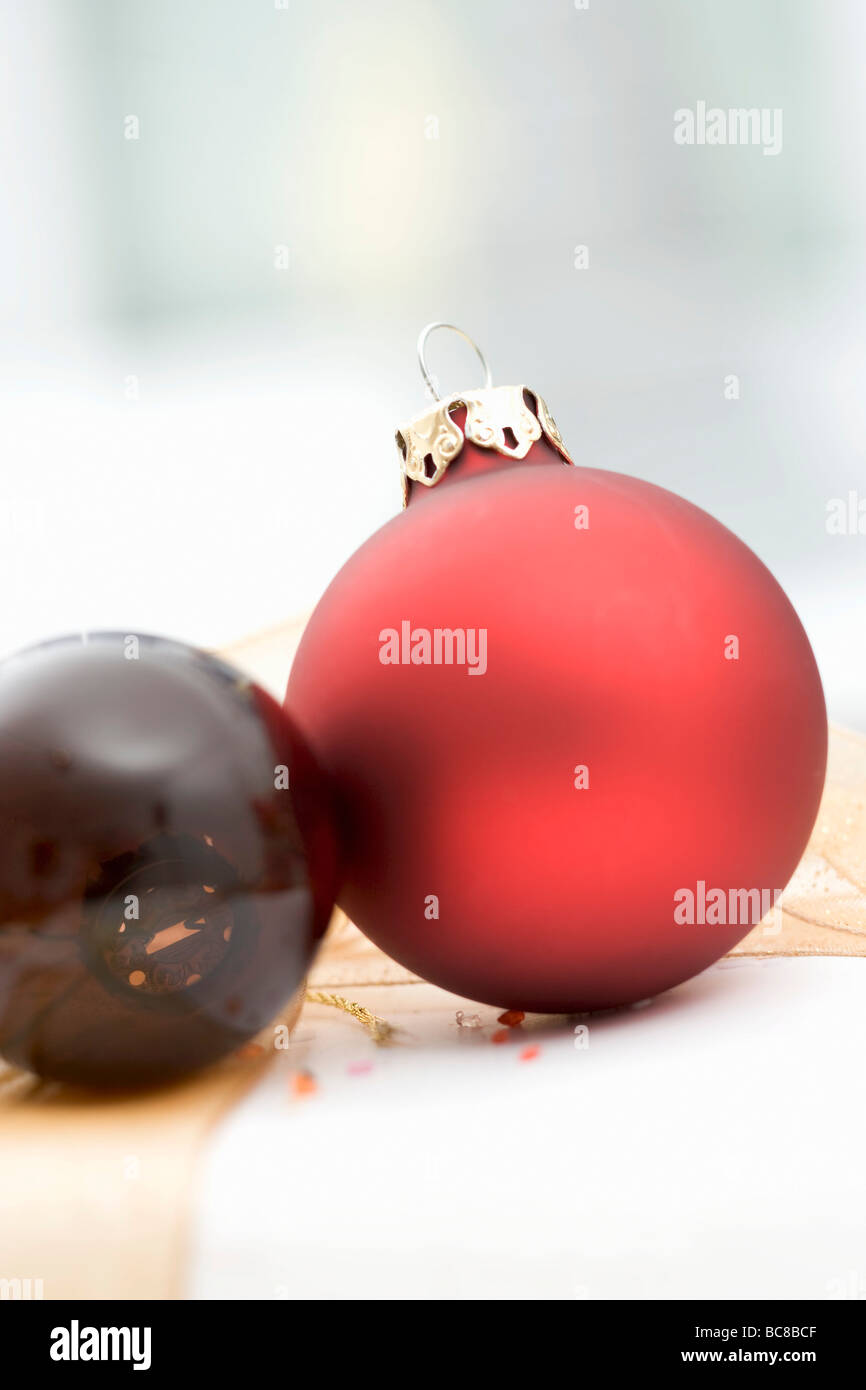 Two Christmas baubles on Christmas parcel Stock Photo - Alamy