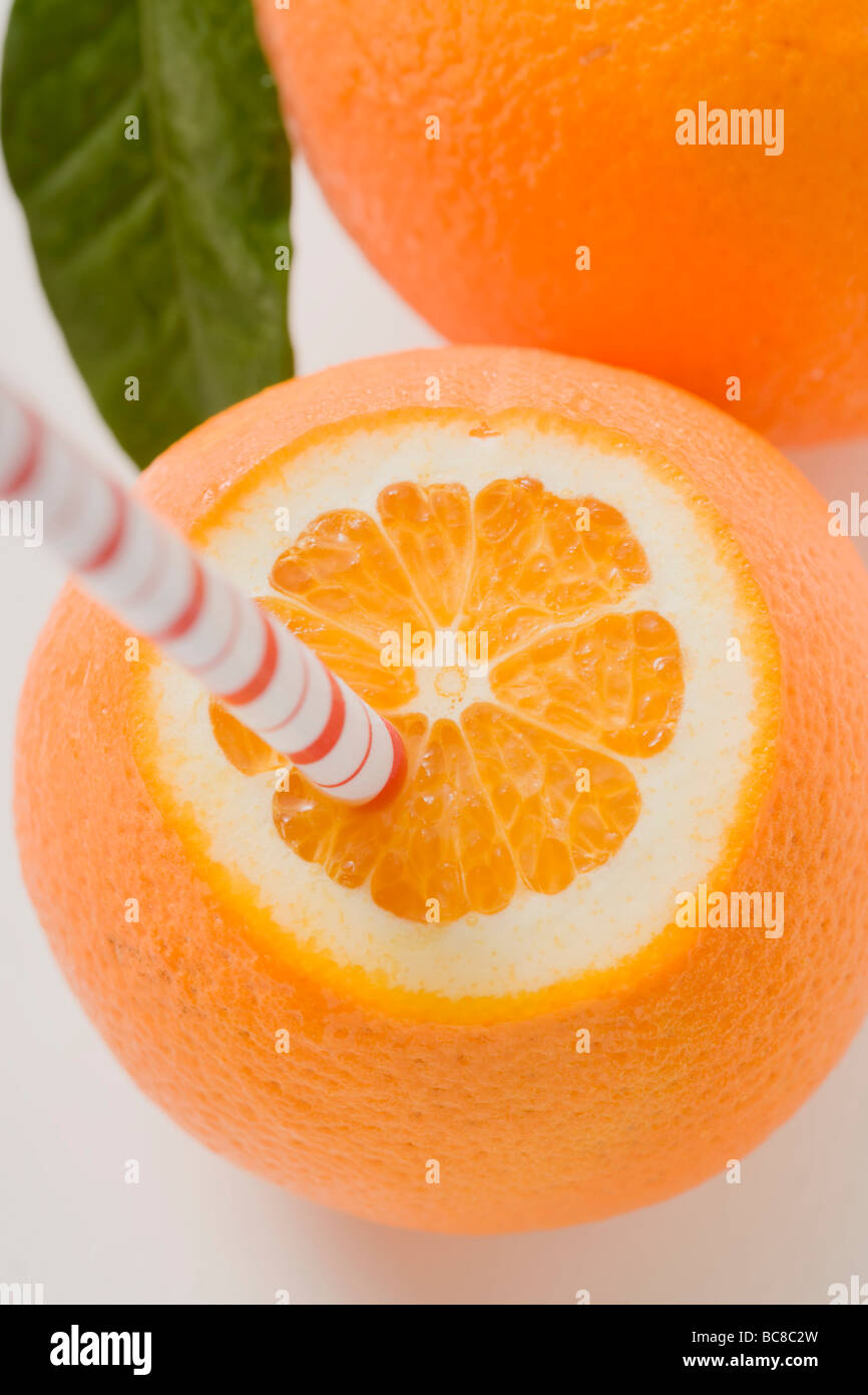 Orange with straw (overhead view Stock Photo - Alamy