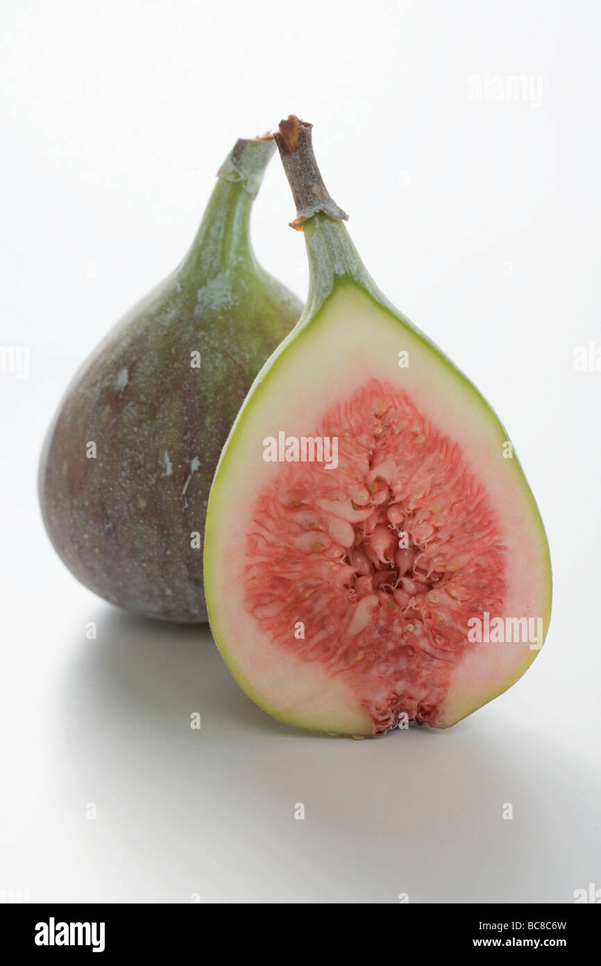 Whole fig and half a fig Stock Photo - Alamy