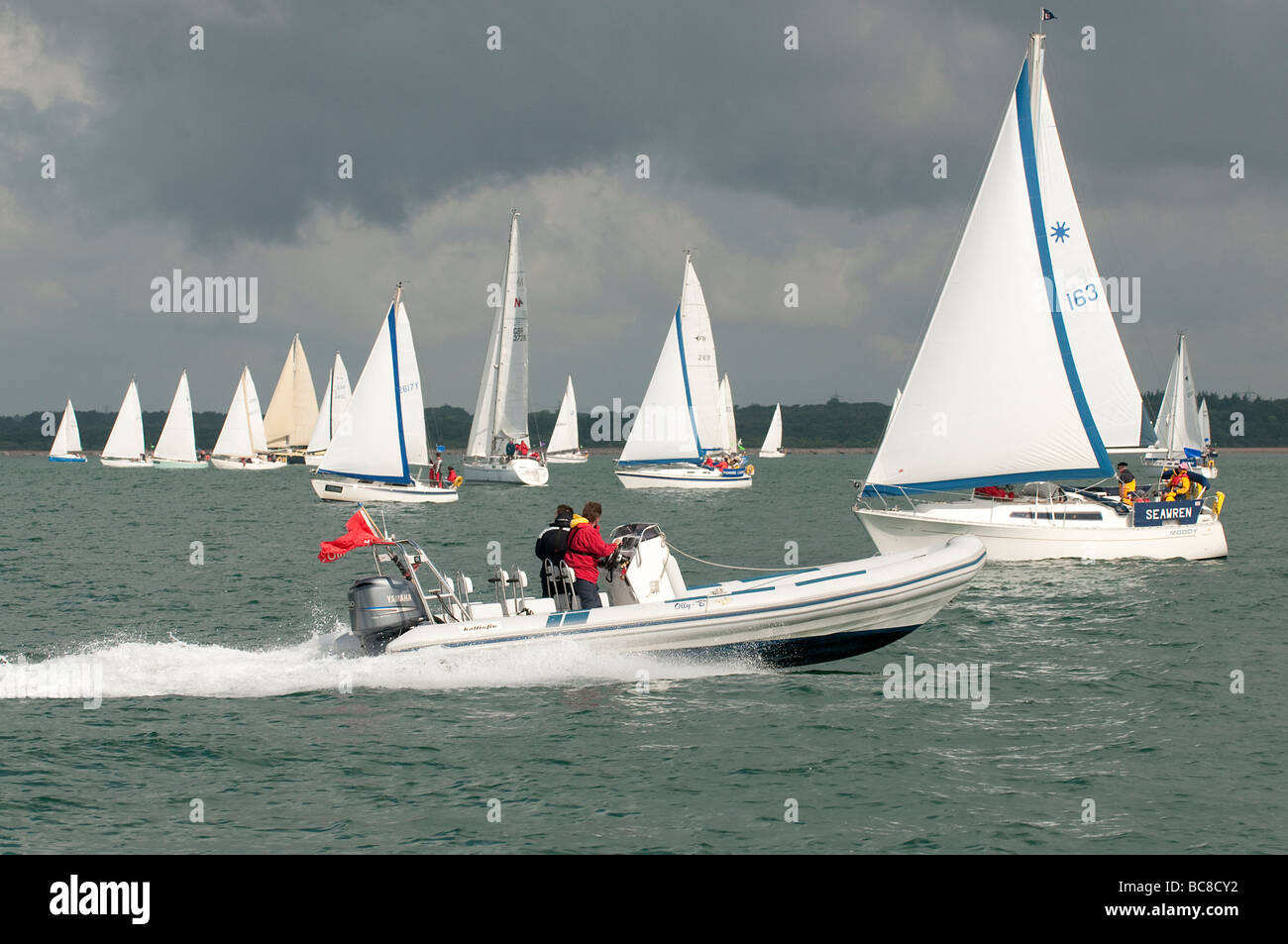 Round the Island Race 2009 RIB passing a sea of yachts Stock Photo - Alamy
