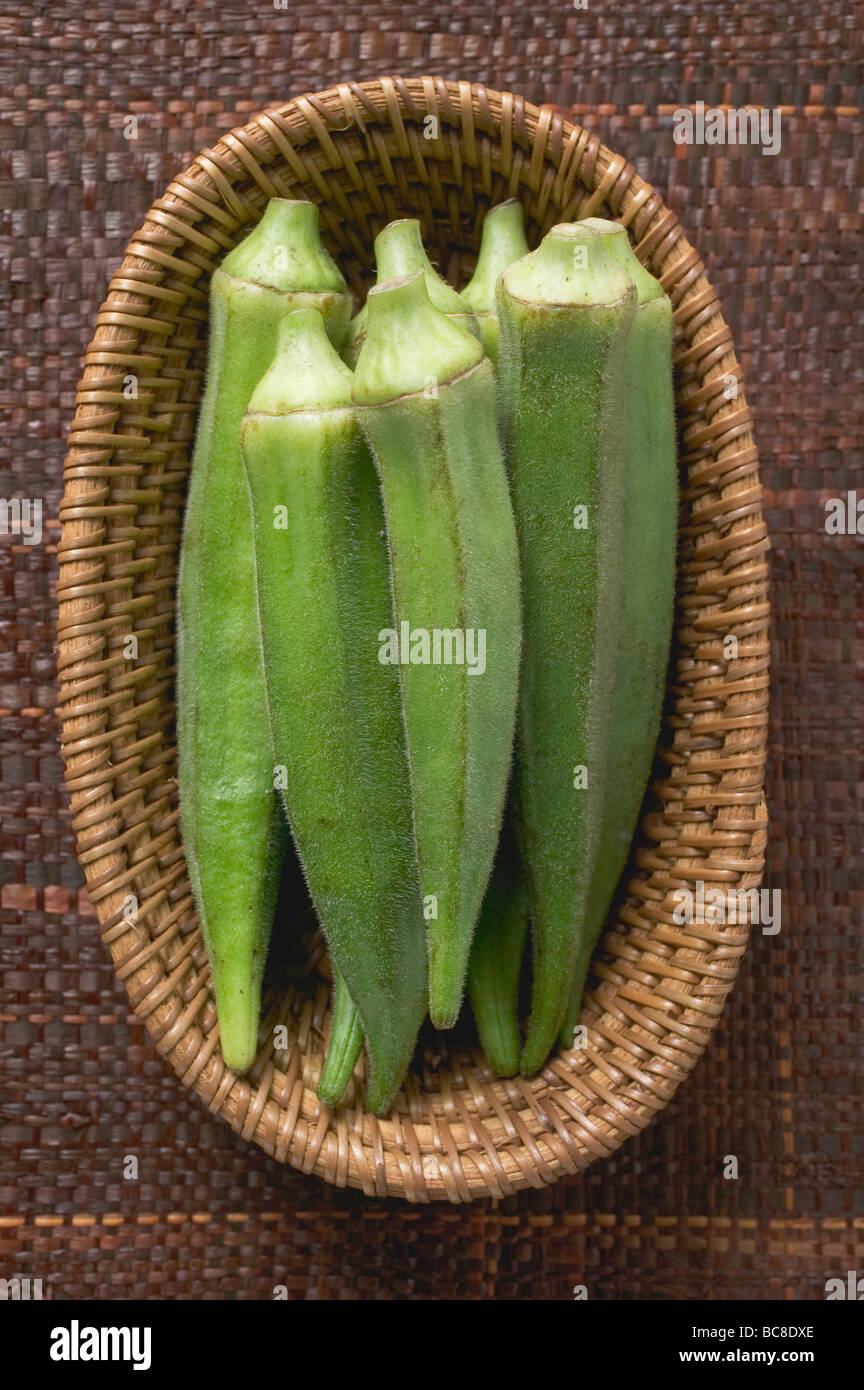 Several okra pods in basket Stock Photo - Alamy