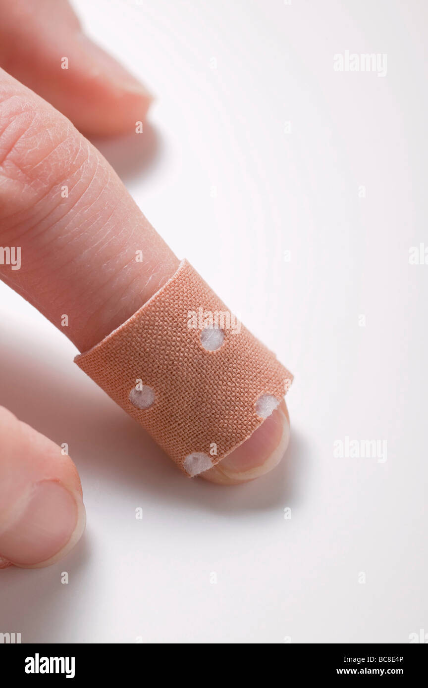 Finger with sticking plaster Stock Photo - Alamy