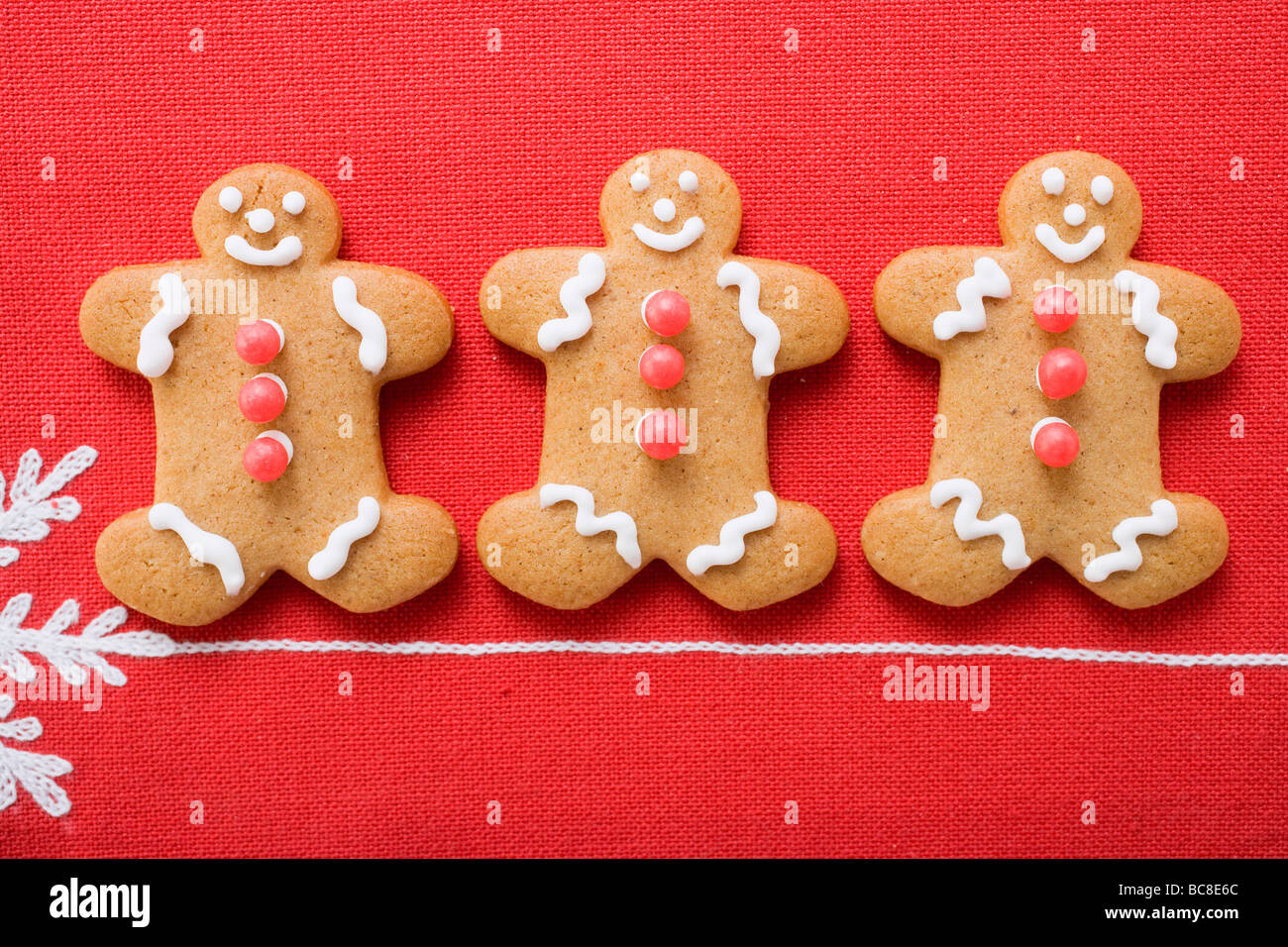 Three gingerbread men Stock Photo - Alamy