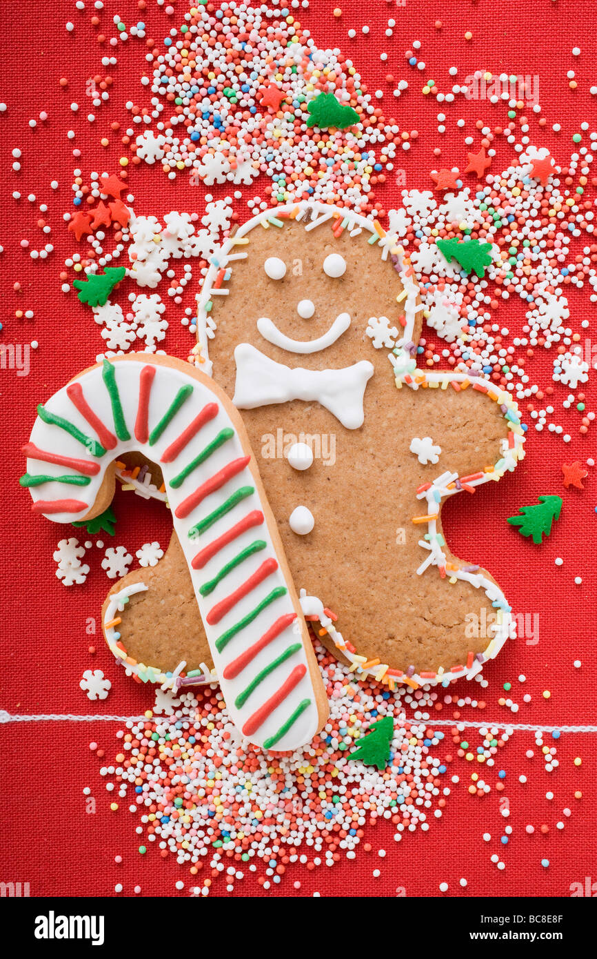 Gingerbread man, candy cane biscuit and sprinkles Stock Photo - Alamy