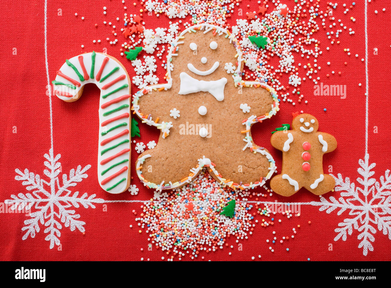 Gingerbread men, candy cane biscuit and sprinkles Stock Photo - Alamy