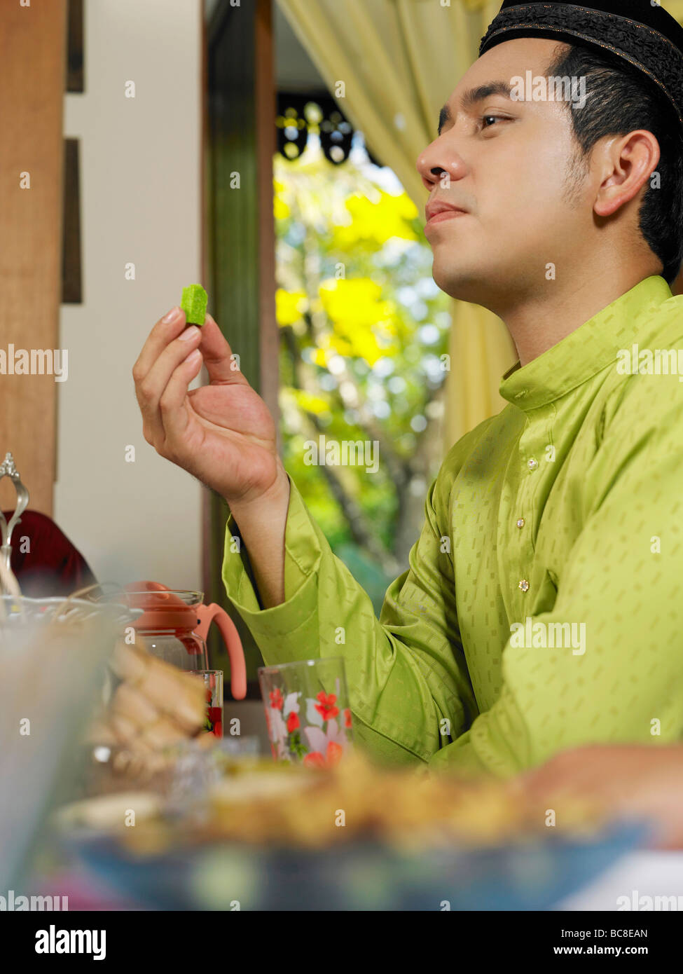 man enjoying eating the festive food Stock Photo - Alamy