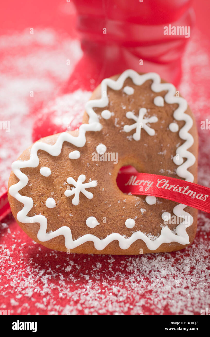Gingerbread heart in front of red boot Stock Photo - Alamy