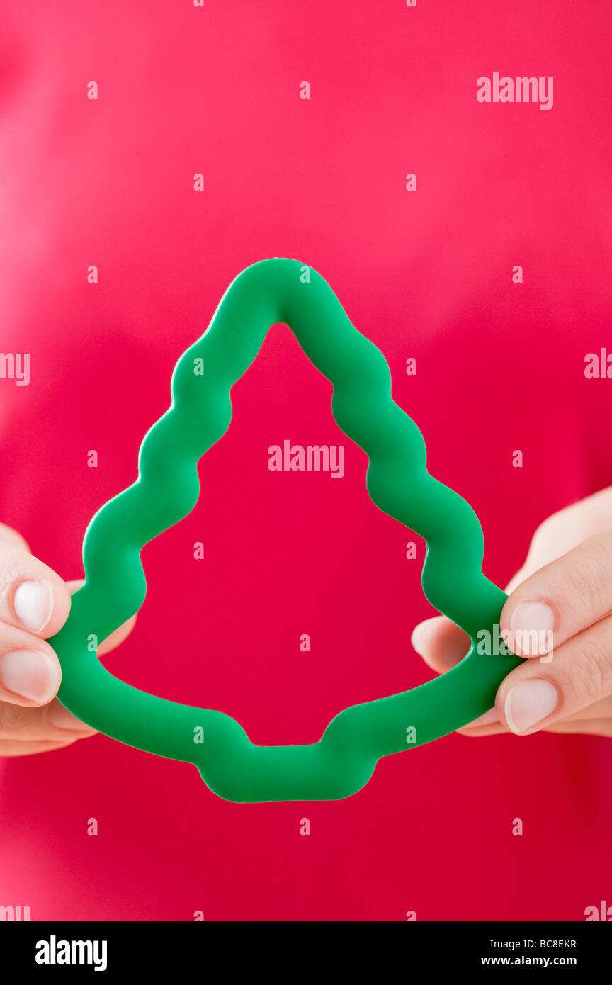 Hands holding cutter (fir tree Stock Photo - Alamy