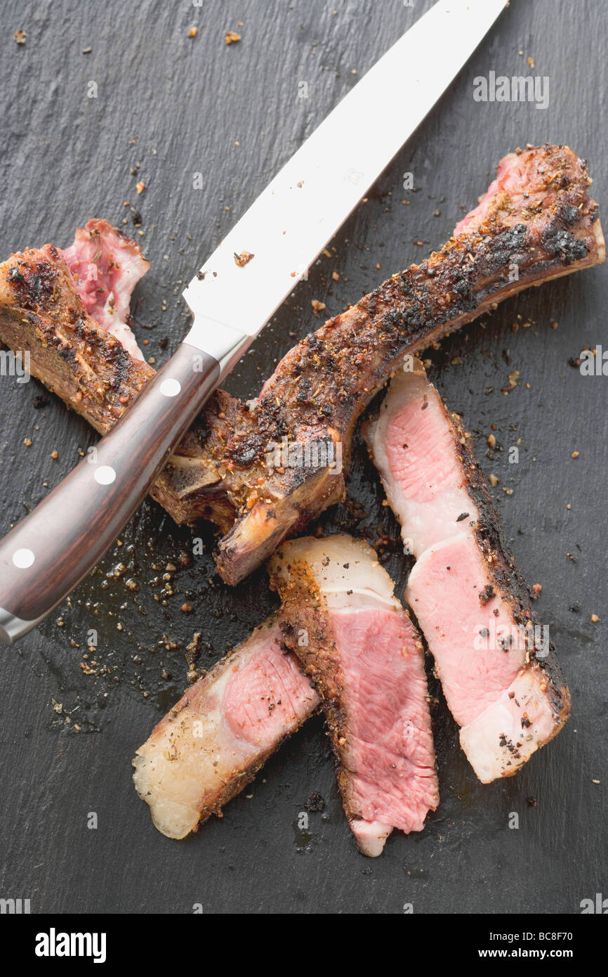 Spicy fried rib eye steak, cut away from the bone Stock Photo - Alamy