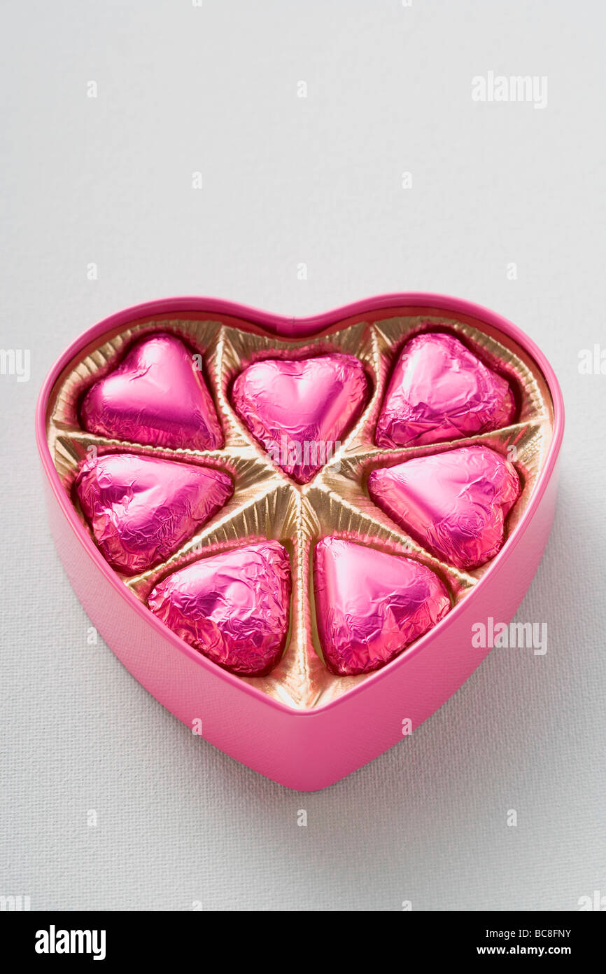 Pink chocolates in heart-shaped box Stock Photo - Alamy