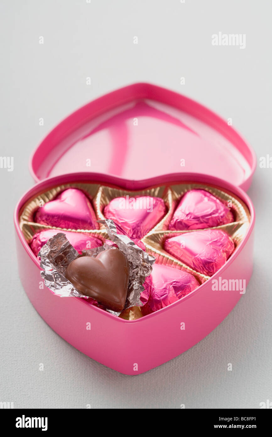 Pink chocolates in heart-shaped box Stock Photo - Alamy