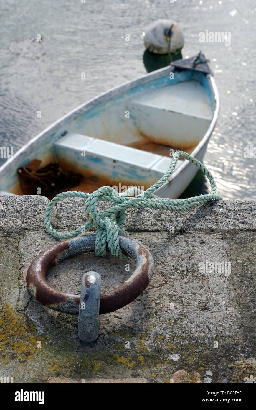 Rope tied to harbour ring and boat, Roscoff, Brittany, France Stock ...