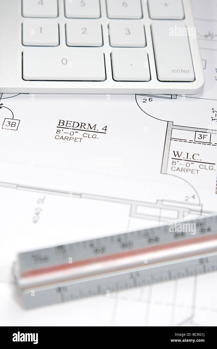 Modern architect using a CAD blueprint and a computer Stock Photo - Alamy