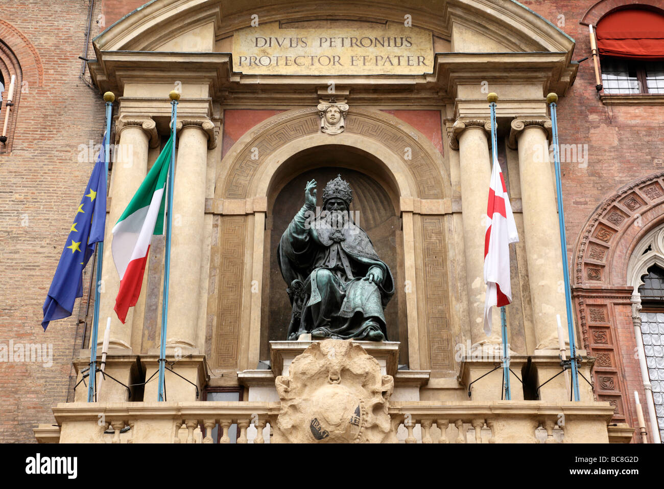 facade of palazzo comunale with the bronze monument of pope gregory ...