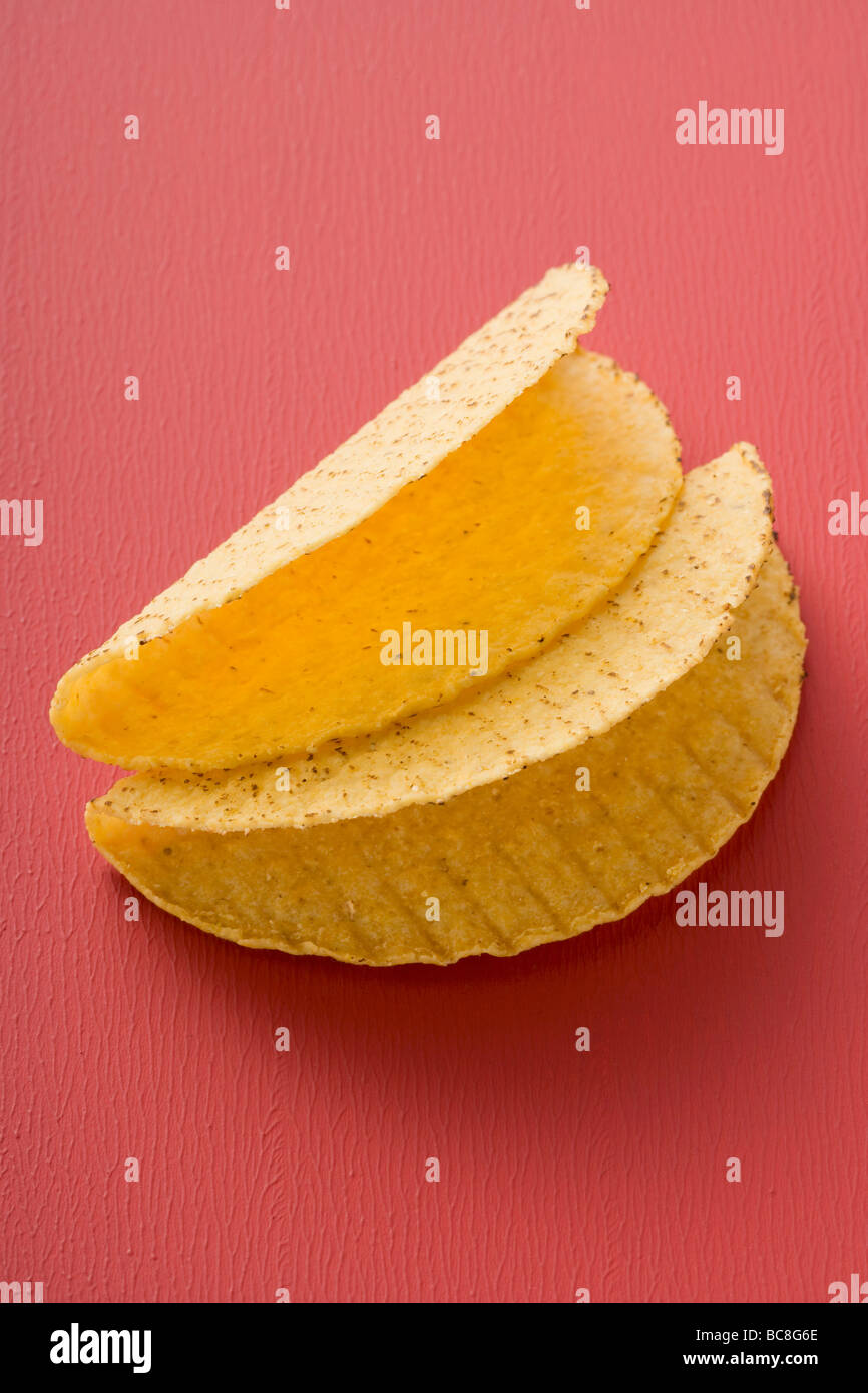 Two taco shells on red background Stock Photo - Alamy
