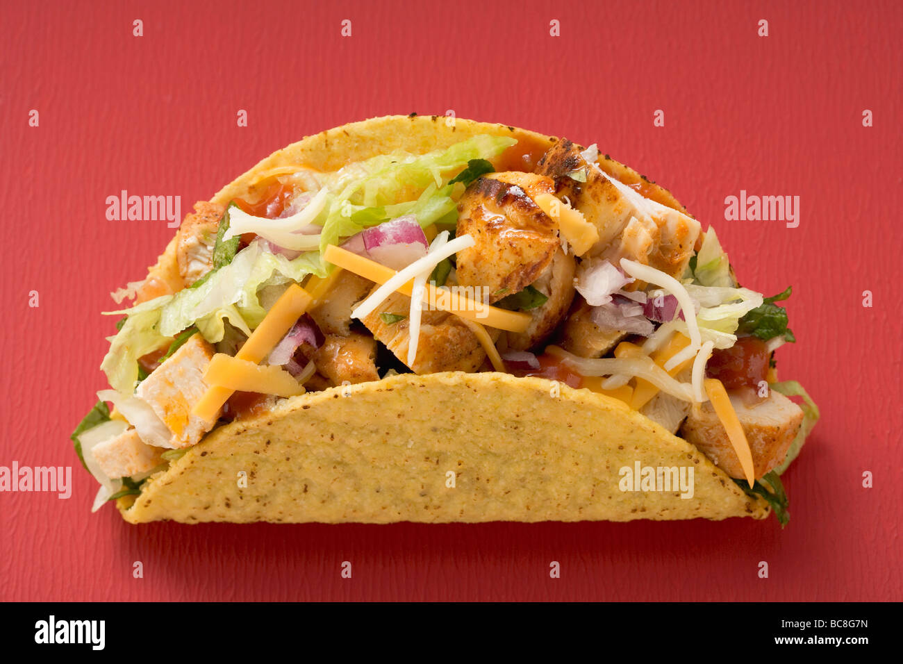Chicken taco (red background Stock Photo - Alamy