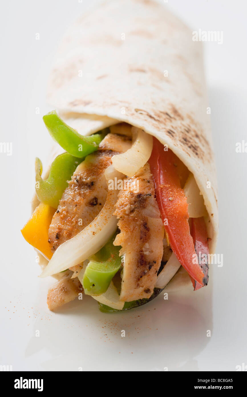 Wrap filled with chicken and peppers Stock Photo - Alamy