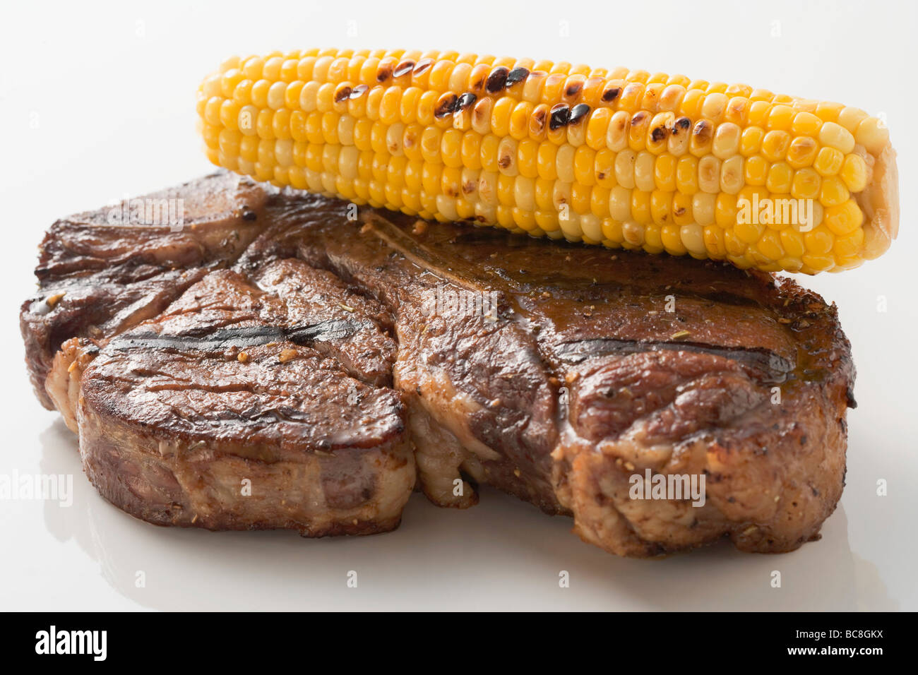 Grilled beef steak with corn on the cob Stock Photo - Alamy